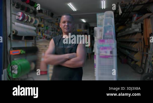 Independent hardware store owner facing camera communicating ...