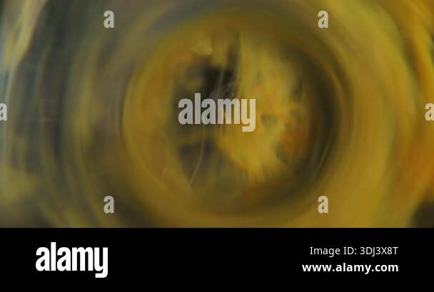 Smoke defocused vortex. Art fume. Yellow paint drop curl spilling in ...
