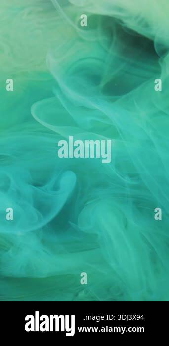 Vertical video. Color smoke cloud. Paint blend. Defocused cyan blue ...
