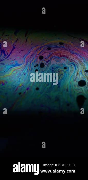 Vertical video. Colorful fluid. Swirl soap. Spectrum oil liquid fantasy ...