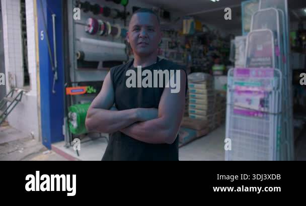 Independent hardware store owner facing camera at workplace ...