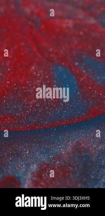 Vertical video. Shimmering splash. Glitter paint spill. Defocused blue ...