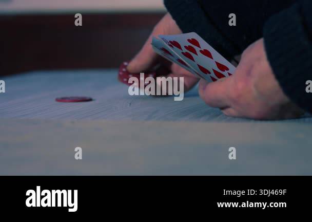 Poker playerwith winning flush hand in card game close up 4k slow ...