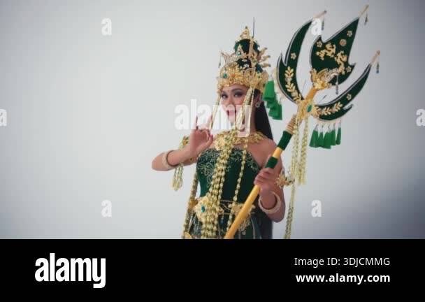 A cinematic side profile of an Indonesian woman portraying a goddess ...