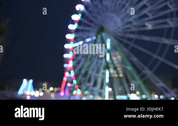 4K footage of carnival fair grounds at night. Defocused footage ...