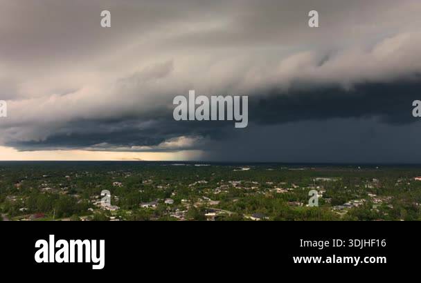 Rain shower water pouring down from stormy clouds during summer ...