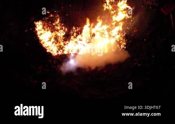 Fire burning of religion joss paper. The fire is very large and is ...