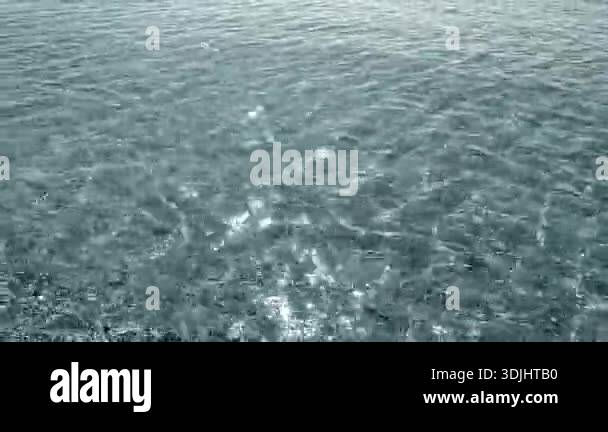 Clean transparent water on shallow sandy seashore with shells with ...