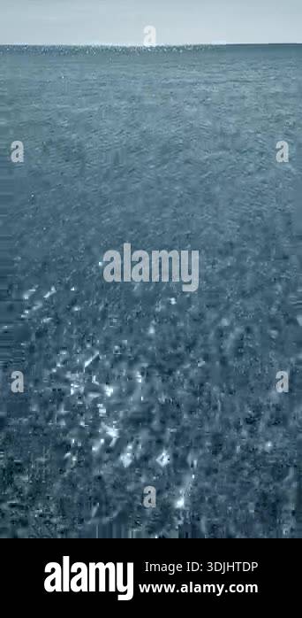 Clean transparent water on shallow sandy seashore with shells with ...