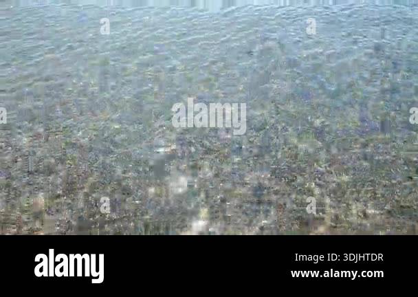 Clean transparent water on shallow sandy seashore with shells with ...