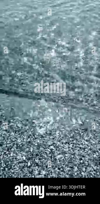 Clean transparent water on shallow sandy seashore with shells with ...