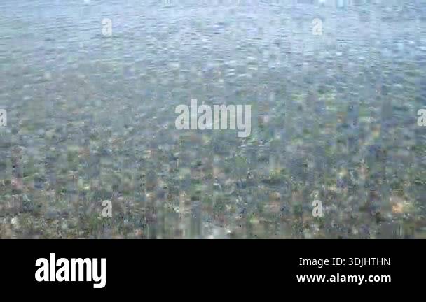 Clean transparent water on shallow sandy seashore with shells with ...