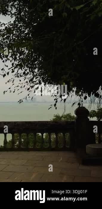 Vertical video. Wide Angle View of Shaded Terrace Overlooking Calm Sea ...