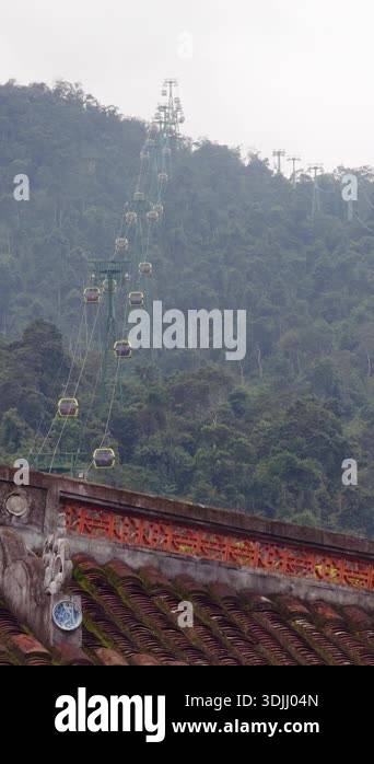 Vertical video. Ancient Ornamental Roof With Curved Details Overlooked ...