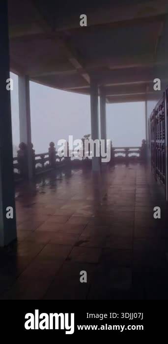 Vertical video. Foggy Balcony Corridor With Wooden Doors and Stone ...