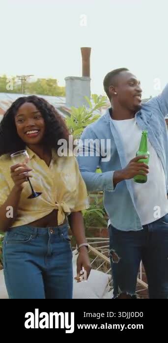 Front view of friendly carefree smiling happy mixed race men and women ...