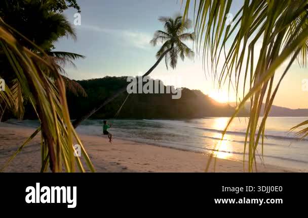 Experience the serene charm of Koh Kood, Thailand, as the sun sets over ...