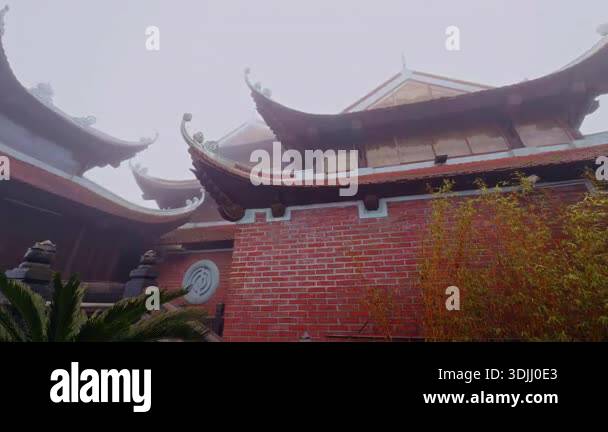 Curved Temple Roofs With Ornate Wooden Details Rising Above Red Brick ...