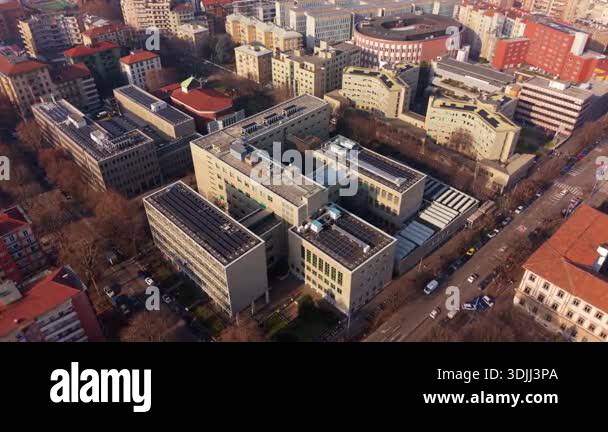 Bird's-eye view flying over a modern city with distinctive architecture ...