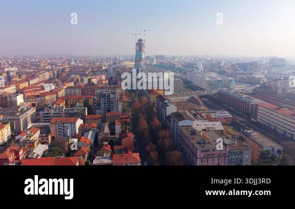 Aerial perspective slowly flying over the city of milan, italy. Urban ...