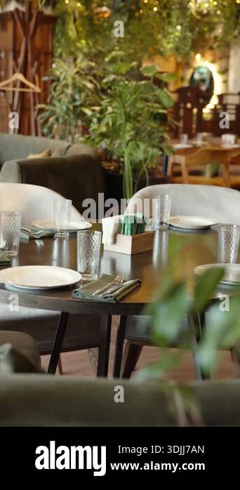 Bishkek, Kyrgyzstan - 22 January 2026: Green restaurant table set with ...