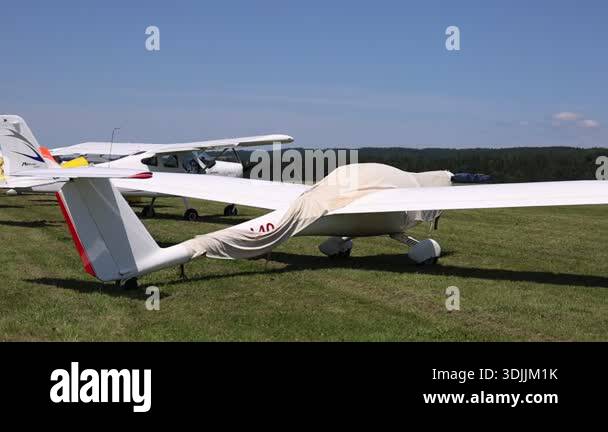 Row of Small Motorized and Glider Aircraft Lined Up on a Mown Grass ...