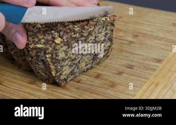 hand cutting fresh slices of hand made bread Stock Video Footage - Alamy