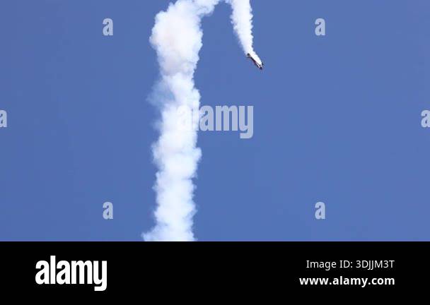 SlowMotion Aerobatic Flight of a Small Sport Aircraft Releasing Vapor ...