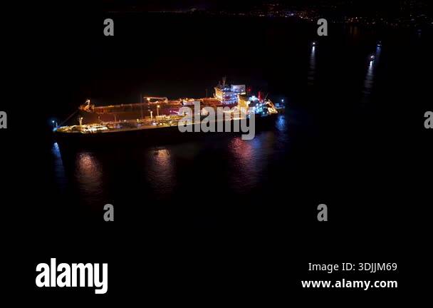Gas tankers anchored and lit up at sea terminal Stock Video Footage - Alamy