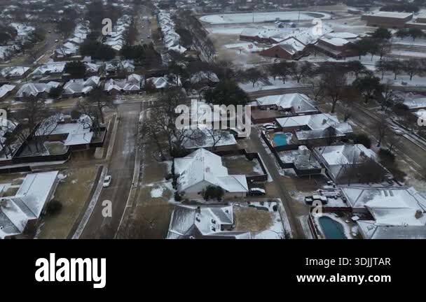 School complex and athletic football field in suburbs Dallas sit under ...