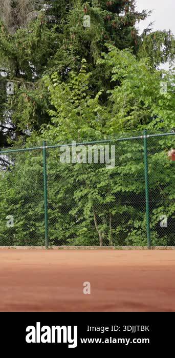 White Male Tennis Player On Clay Performing Dramatic Airborne Serve ...