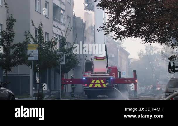 Boom crane, Fire rescue, Smoke plume. Urban firefighting operation with ...