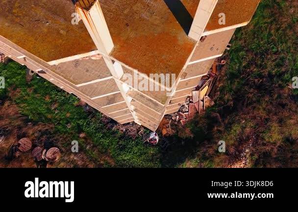 Structure with several floors and debris scattered around. Structure at ...