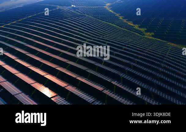 Going up over the fields covered with multiple solar panels ...