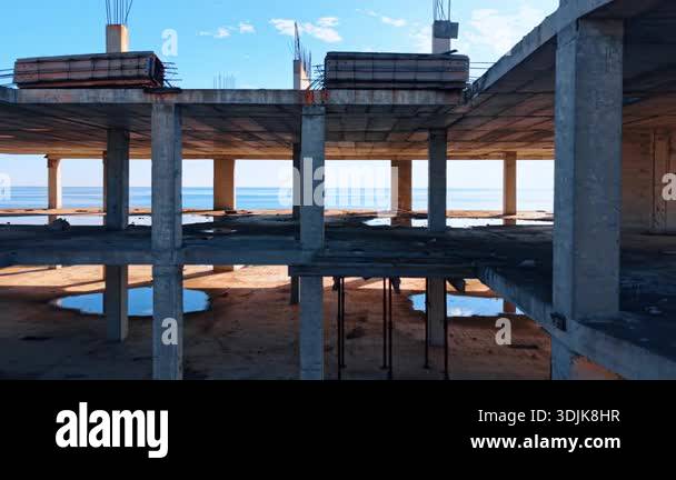 Inside the concrete frame of the building under construction. Debris ...