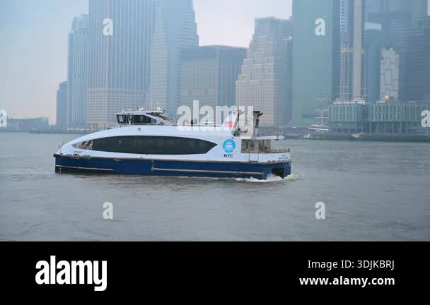 New York, USA, 24 December 2025: Brooklyn Bridge and ferry winter scene ...