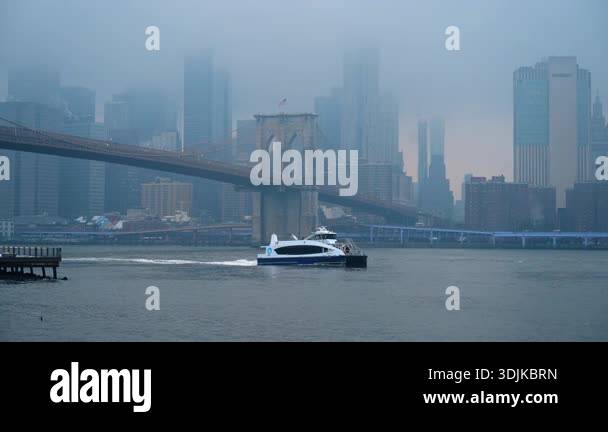 New York, USA, 24 December 2025: Modern motor boat moves by the river ...