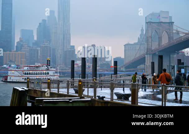 New York, USA, 24 December 2025: Brooklyn Bridge winter waterfront ...