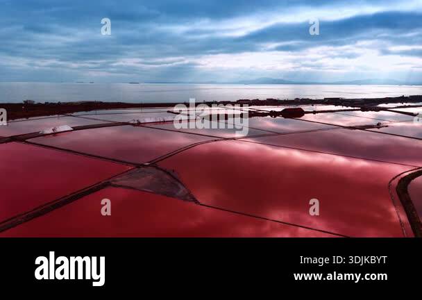 Pink salt evaporation ponds separated from seawater. Salt farms ...