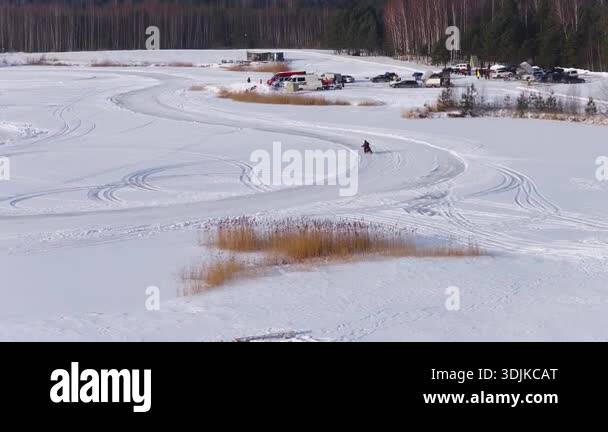 Aerial view shows a frozen lake in Latvia as motorcyclists race an S ...