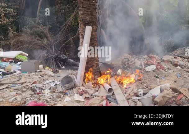 Open Trash Burning Causing Smoke Pollution Stock Video Footage - Alamy