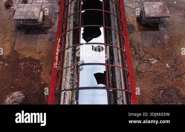 Aerial view of a decaying building featuring a glass roof with ...