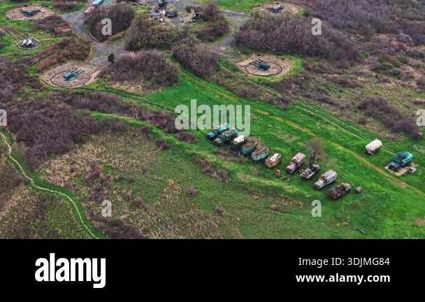 This aerial view shows military vehicles parked near artillery ...