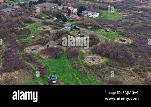 Aerial view of a military base with various installations and equipment ...