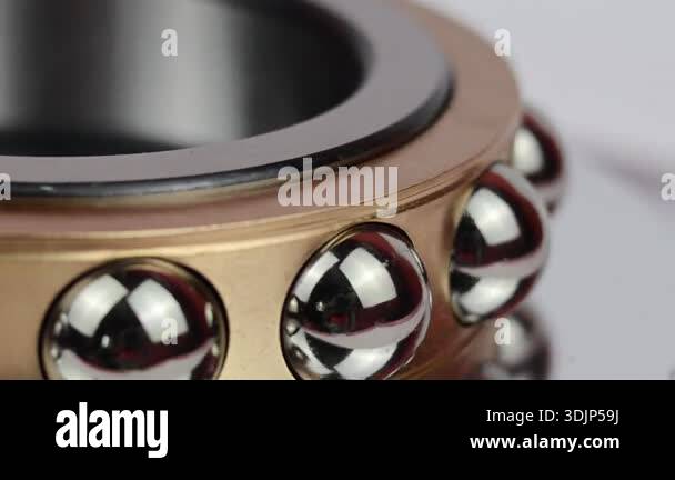 Close-up side view of a high precision industrial steel ball bearing ...