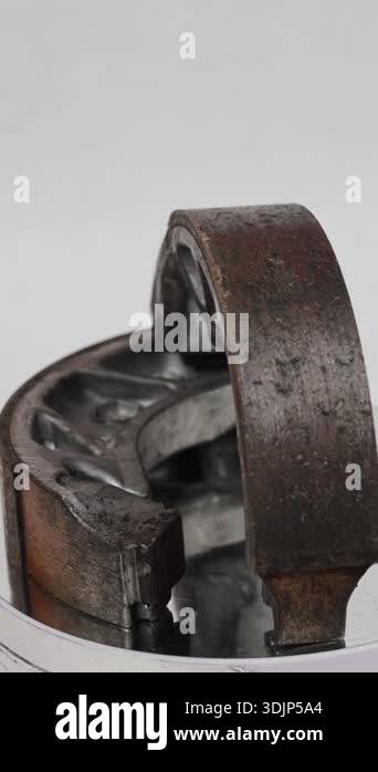 Pair of worn motorcycle drum brake shoes isolated on white background ...