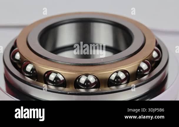 Close-up side view of a high precision industrial steel ball bearing ...