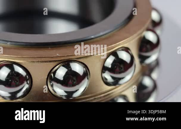 Close-up side view of a high precision industrial steel ball bearing ...