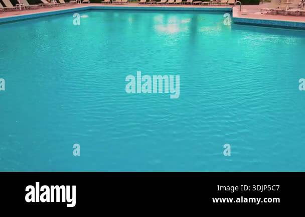 Beautiful view of clear turquoise swimming pool water in luxury resort ...