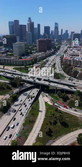 Vertical drone footage showing downtown Los Angeles highway traffic ...